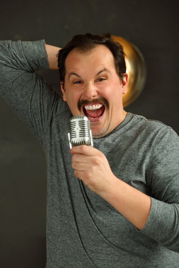 Outrageous Man with Mustache Sing into Microphone Stock Image - Image ...