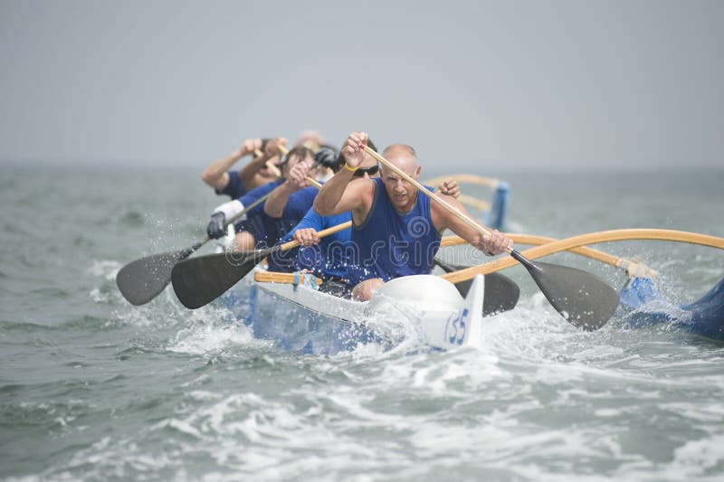 Outrigger Canoeing Team in Race Stock Image - Image of male, crew: 33897671