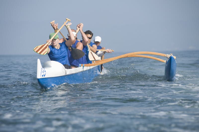 Outrigger Canoeing Team in Race Stock Image - Image of male, canoeist ...