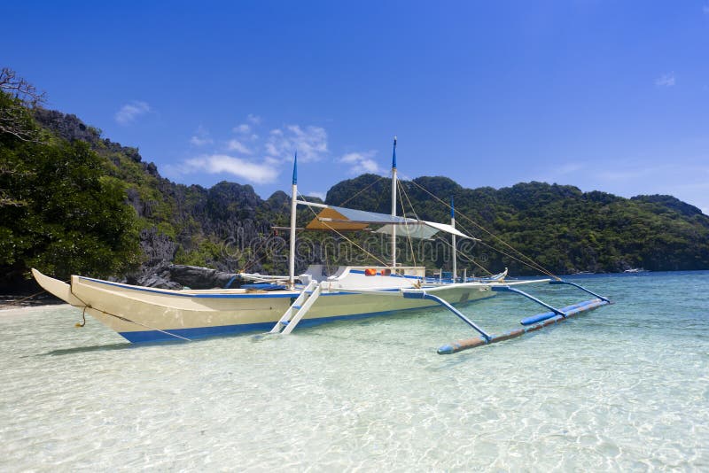 Outrigger Ship Moored at Seaside Stock Image - Image of lagoon, harbor ...