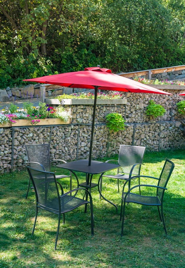 Outside Cafe Table on Green Lawn Under the Red Canopy Stock Photo ...