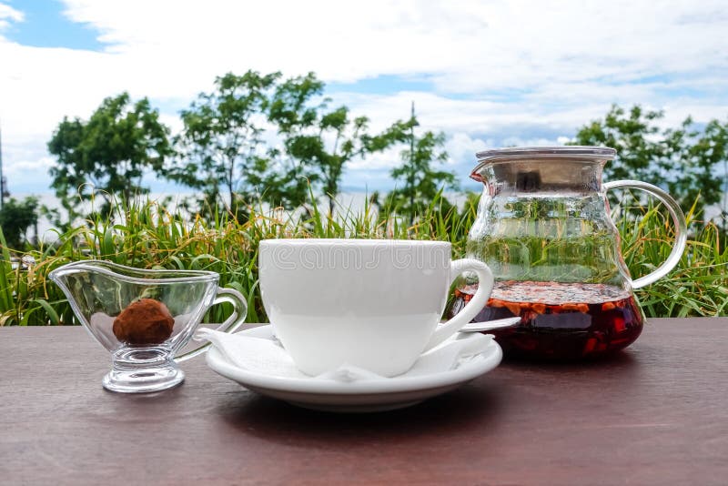 Outside Cafe Terrace Table with Tea Cup and Pitcher Stock Photo - Image ...