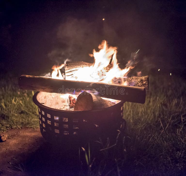 An Outside Fire in a Fireproof Container with Several Embers in the Air ...