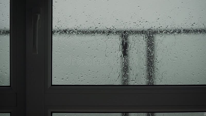 Outside is Raining and Inside View of the Window Frame and Glass. Close ...