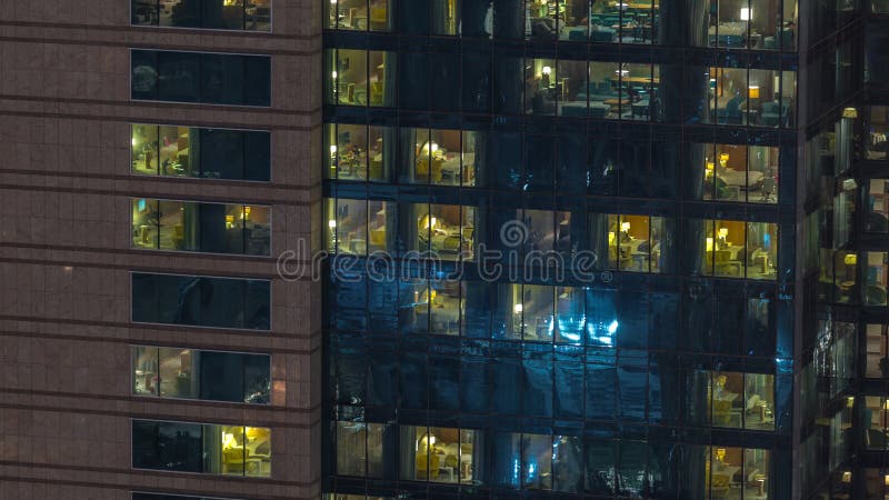 Outside View of Windows in Apartments of a High Class Building at Night ...