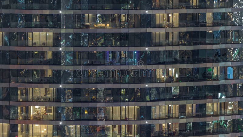 Outside View of Windows in Apartments of a High Class Building at Night ...
