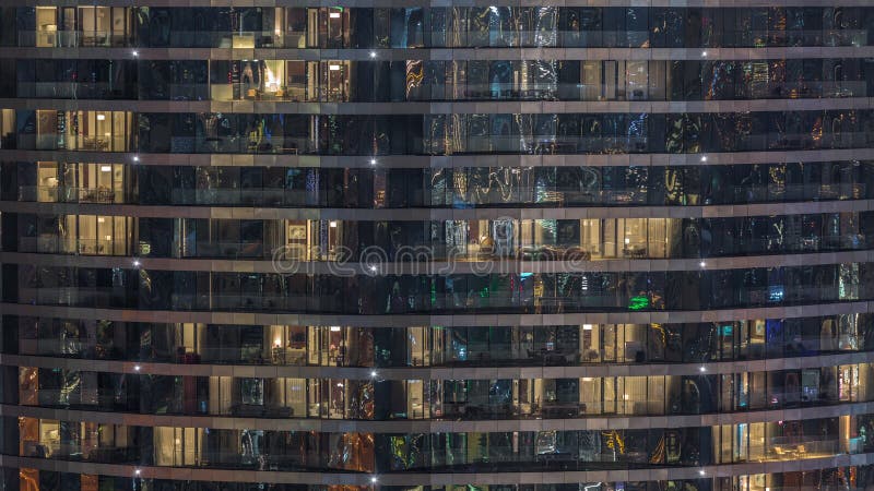 Outside View of Windows in Apartments of a High Class Building at Night ...