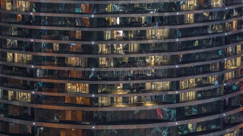 Outside View of Windows in Apartments of a High Class Building at Night ...