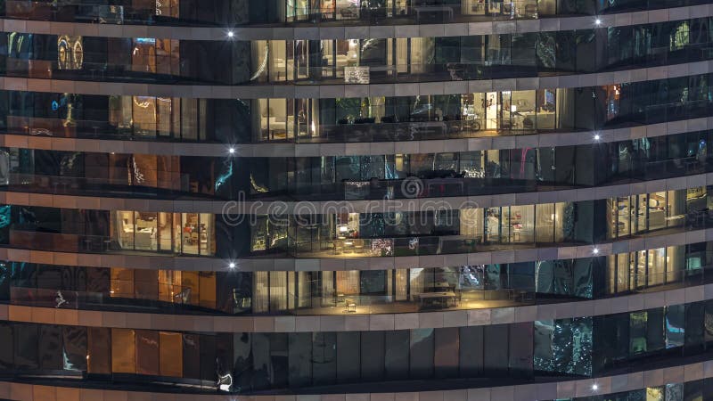 Outside View of Windows in Apartments of a High Class Building at Night ...