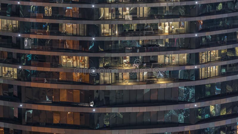 Outside View of Windows in Offices of a High Class Building at Night ...