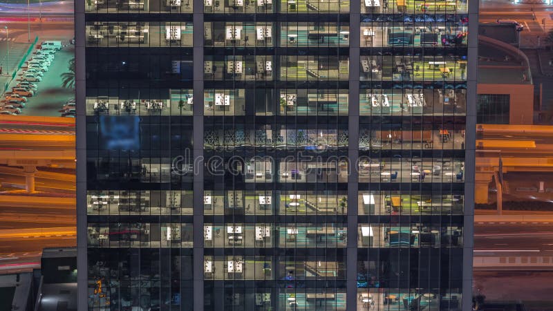 Outside View of Windows in Offices of a High Class Building at Night ...
