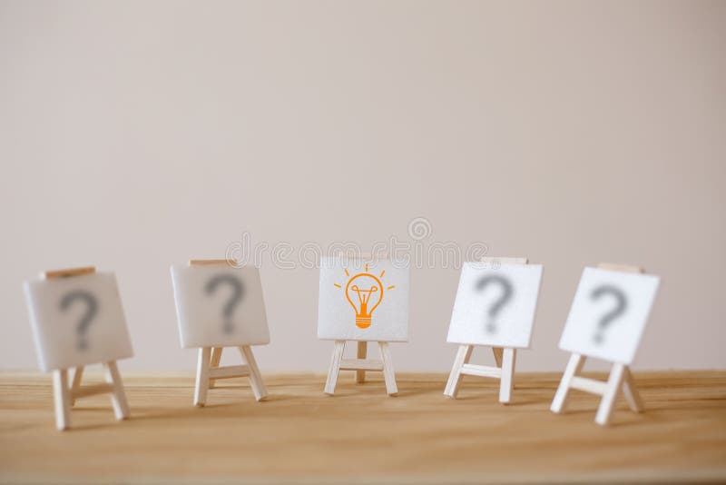 Outstanding Sign Stand with a Light Bulb Icon and Question Mark Symbol ...