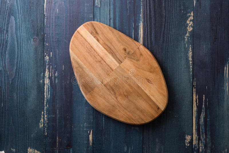 Oval Cutting Board on Blue Wooden Background Stock Photo - Image of ...