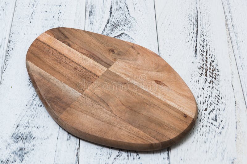 Oval Cutting Board on White Wooden Background Side View Stock Photo ...