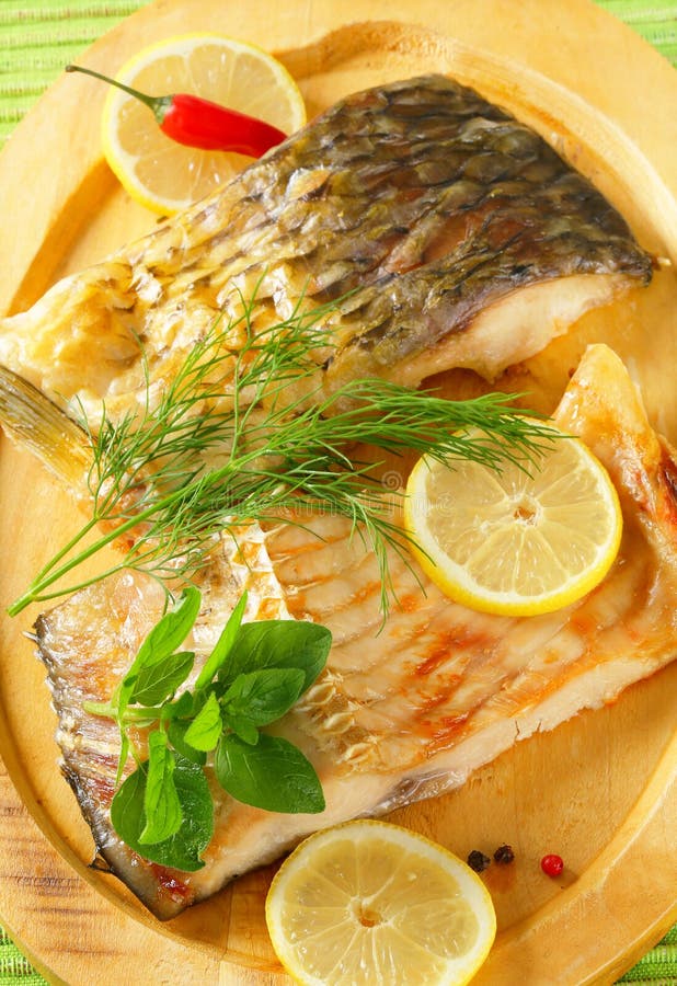Oven baked carp fillet stock photo. Image of board, entree - 33977096