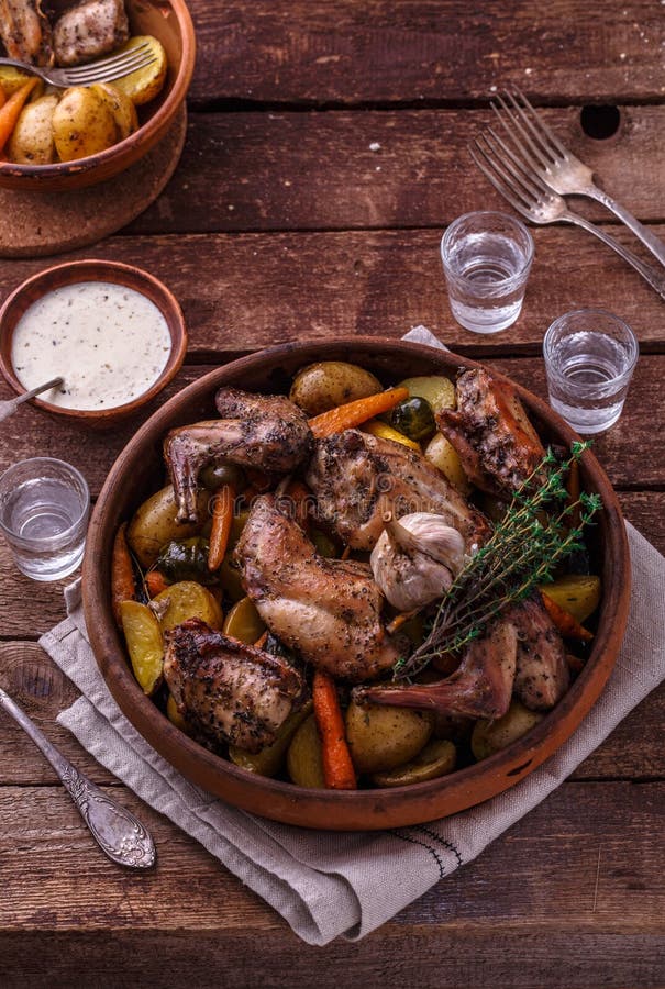 Oven Baked Rabbit with Garlic Sauce, Copy Space Stock Photo - Image of ...
