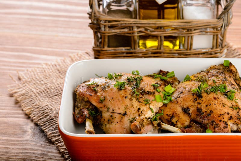 Oven Baked Rabbit with Herbs on Wooden Table. Stock Image - Image of ...