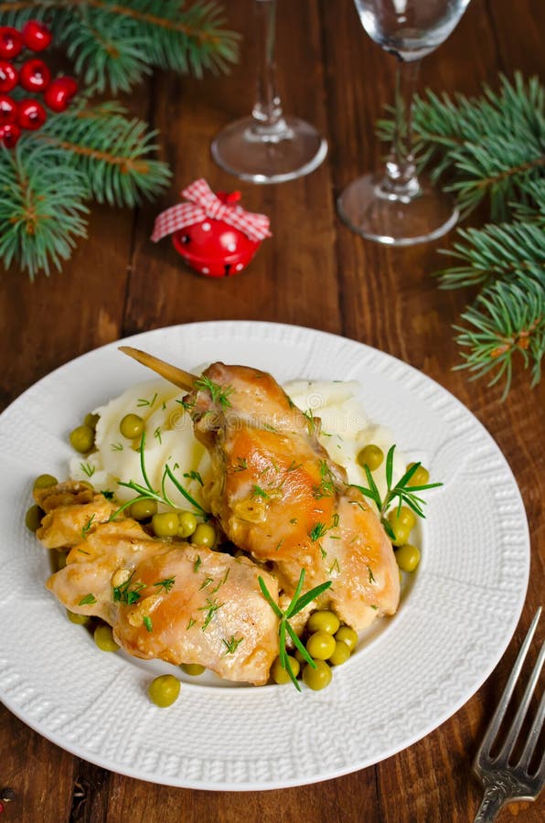 Oven Baked Rabbit Legs with Potatoes and Rosemary Stock Photo - Image ...