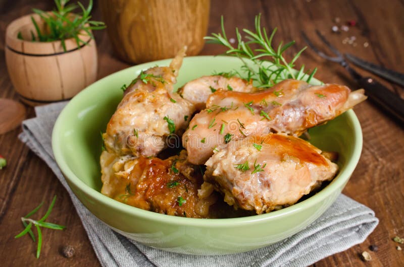 Oven Baked Rabbit Legs with Potatoes and Rosemary Stock Photo - Image ...