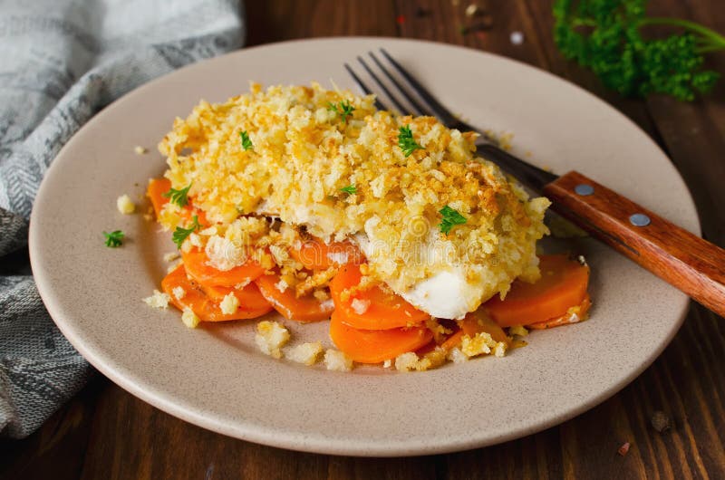 Oven-roasted Fish Fillet with Carrots Under a Bread Crust Stock Photo ...