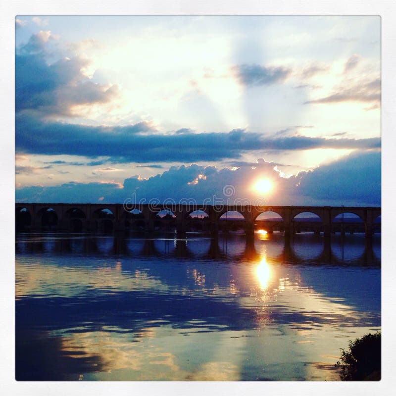 Over the Bridge and into the Heavens Stock Photo - Image of beaming ...