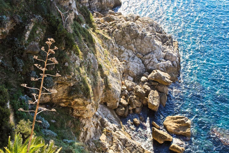 Over the cliff stock image. Image of green, grass, rocks - 61218103