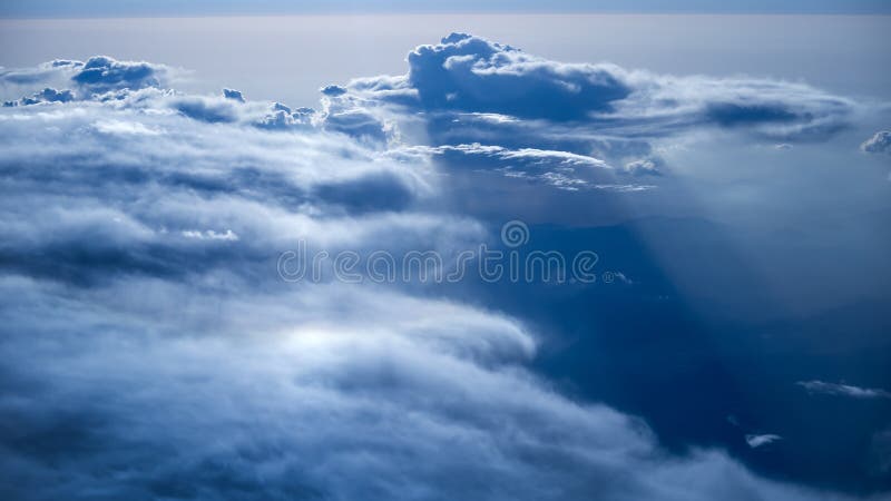 Over the Clouds in Early Morning. Clouds with Sun Rays in Blue Sky Stock Photo - Image of rays ...