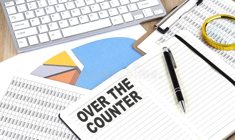 OVER the COUNTER Text on Notebook with Chart and Keyboard Stock Photo ...