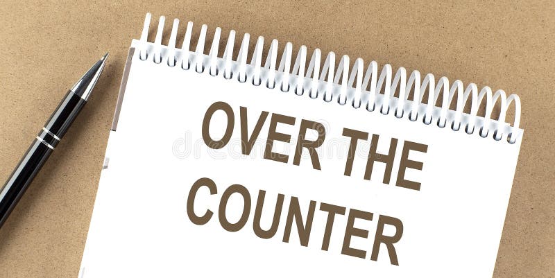OVER the COUNTER Text on a Notepad with Pen, Business Stock Image ...