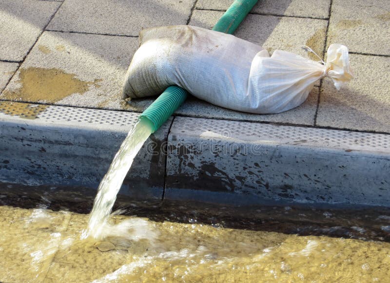 Over flow hose pipe stock photo. Image of turbulent, pavement - 55388144