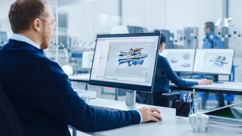 Over Shoulder: Heavy Industry Engineer Working on Personal Computer ...