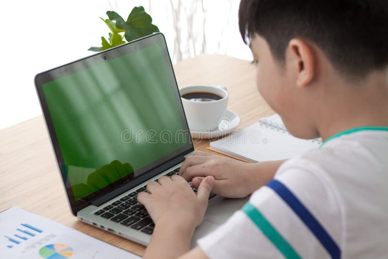 Over the Shoulder Shot of an Asain Boy Typing on a Computer Lapt Stock ...