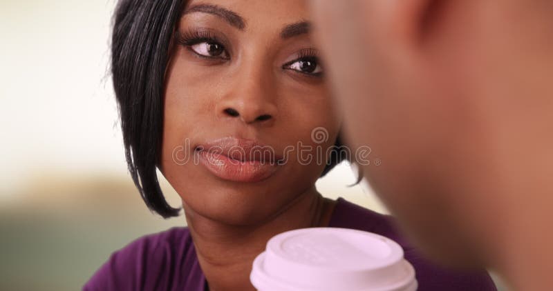Over the Shoulder Shot of Black Couple Sitting in CafZ Talking and ... Over the Shoulder Shot of Black Couple Sitting in CafZ Talking and ...