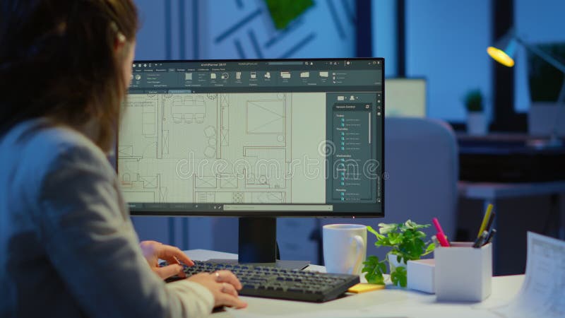 Over the Shoulder Shot of Engineer Working with Architectural Plans ...