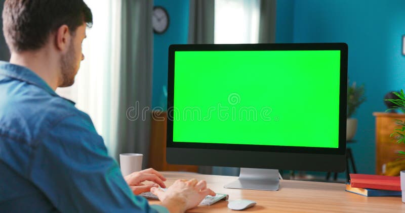 Over the Shoulder Shot of Man Typing on a Keyboard Computer with Blank ...