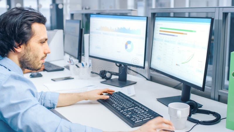 Over the Shoulder Shot of Motivated Office Worker Working on Desktop ...