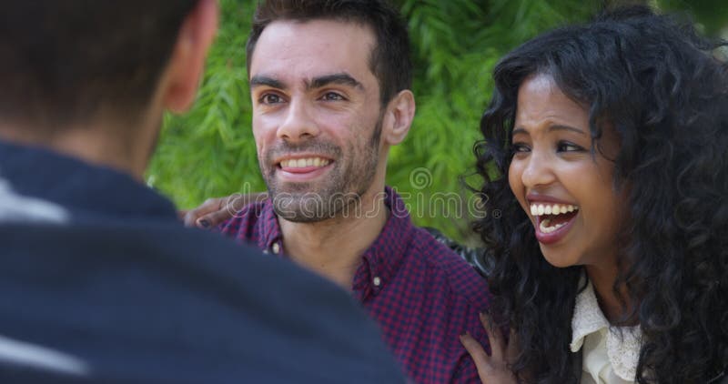 Over the Shoulder Shot of Multi Ethnic Group of Friends Laughing ...