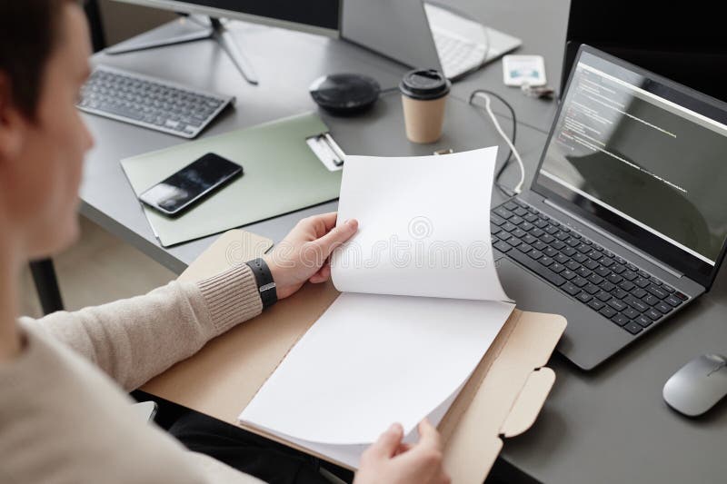 It Worker Looking through Papers in Office Stock Image - Image of code ...