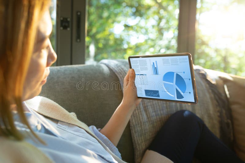 Over Shoulder View of Asian Woman Using Tablet with Data Processing on ...