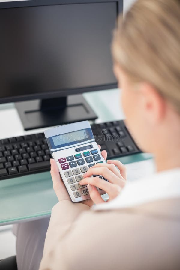 Over Shoulder View of Businesswoman Using Calculator Stock Image ...