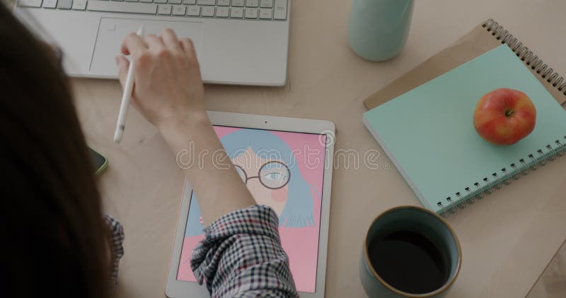 Over the Shoulder View of Female Designer Drawing with Graphics Table ...