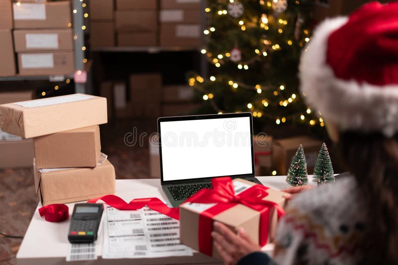 Over Shoulder View of Female Santa Holding X-mas Gift Using Laptop ...