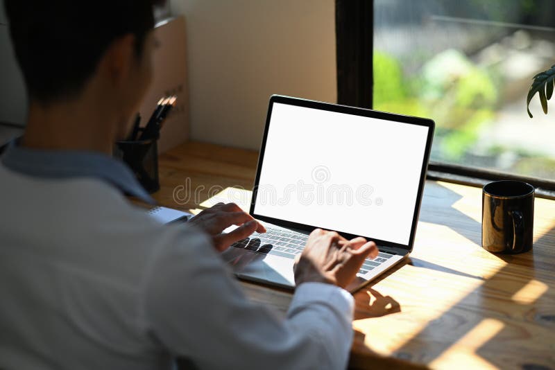 Over Shoulder View of Focused Male Office Worker Using Laptop Computer ...