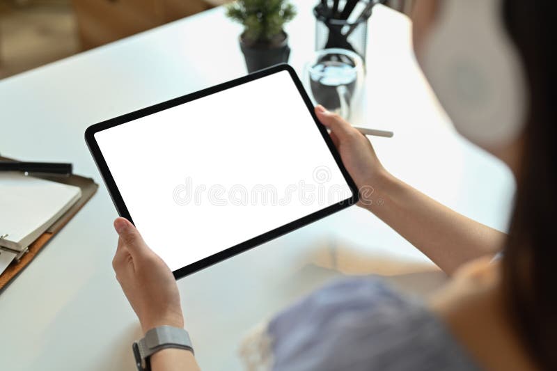 Over Shoulder View of Woman Wearing Headphone Using Digital Tablet ...