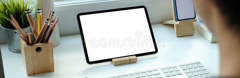 Over Shoulder View of Young Man Using Digital Tablet on White Table at ...