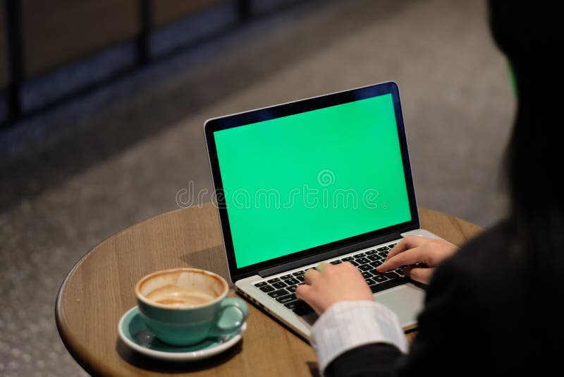 Woman Typing on Green Screen Laptop Computer in Cafe Stock Image ...