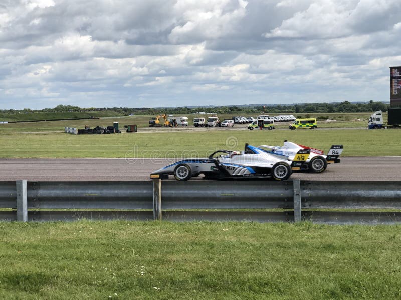 Over Taking Battle it Out on a Race Track Editorial Photography - Image ...