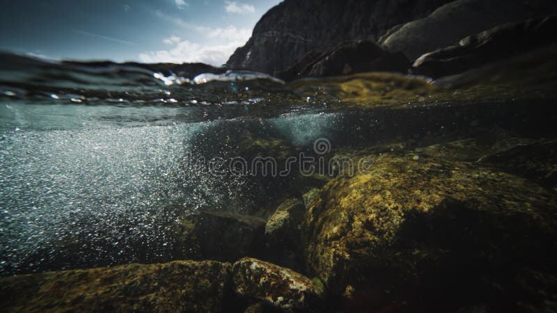 Over-under Shot of the Water and Mountains Stock Footage - Video of ...