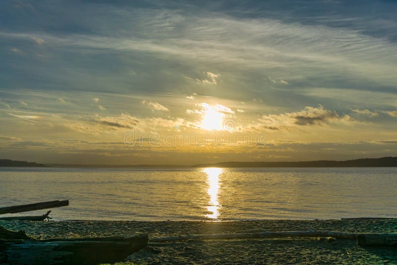 Overcast Cloudy Sunset stock image. Image of sound, ocean - 129665031