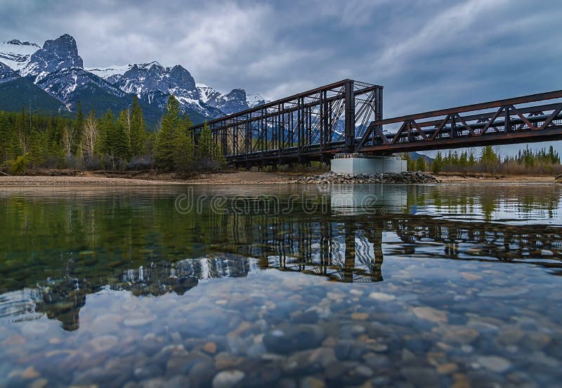 Overcast Sky Over Mountains by the Canmore Engine Bridge Stock Image ...